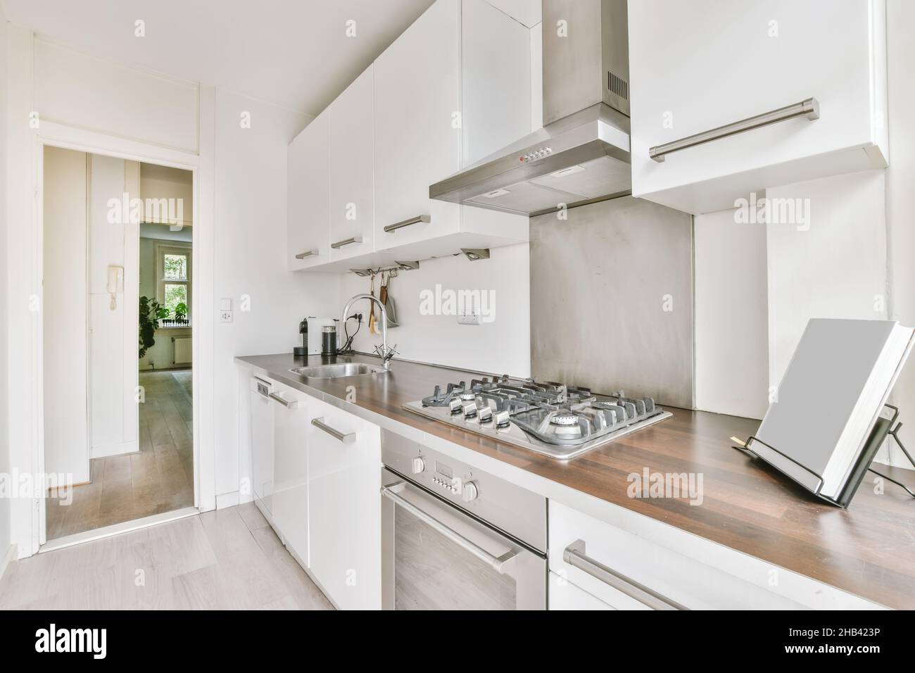 Superior kitchen design with wood worktop and white kitchen unit Stock ...