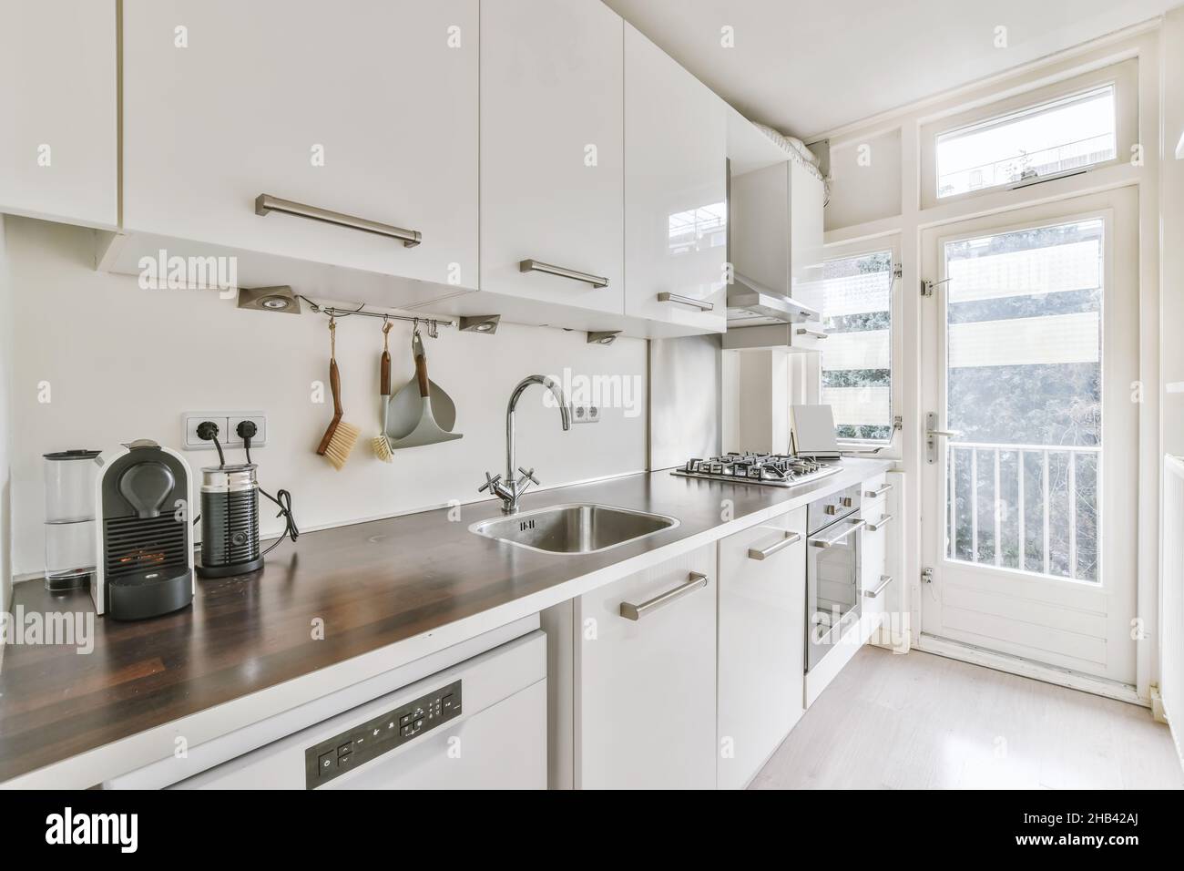 Superior kitchen design with wood worktop and white kitchen unit Stock ...