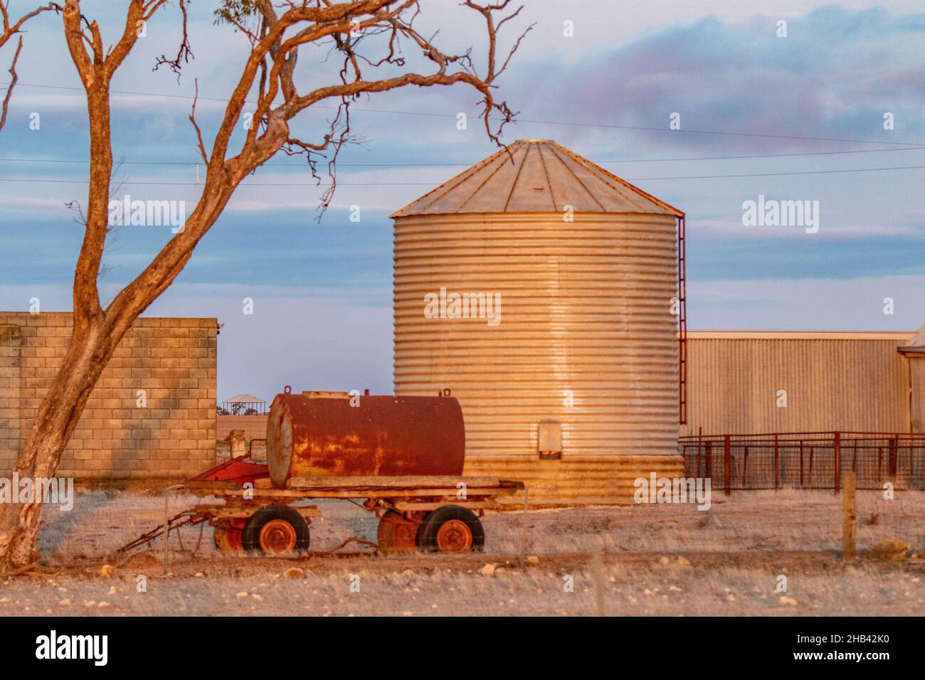Rural scenery with a silos tower at sunset Stock Photo - Alamy