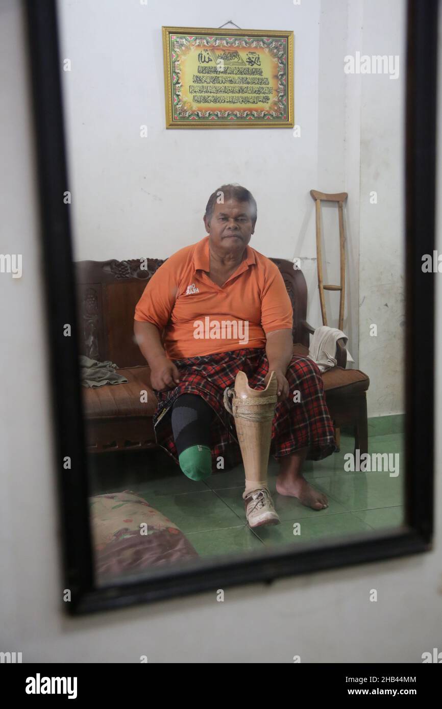 Bekasi, West Java, Indonesia. 16th Dec, 2021. Suparni, 65, a retired ...