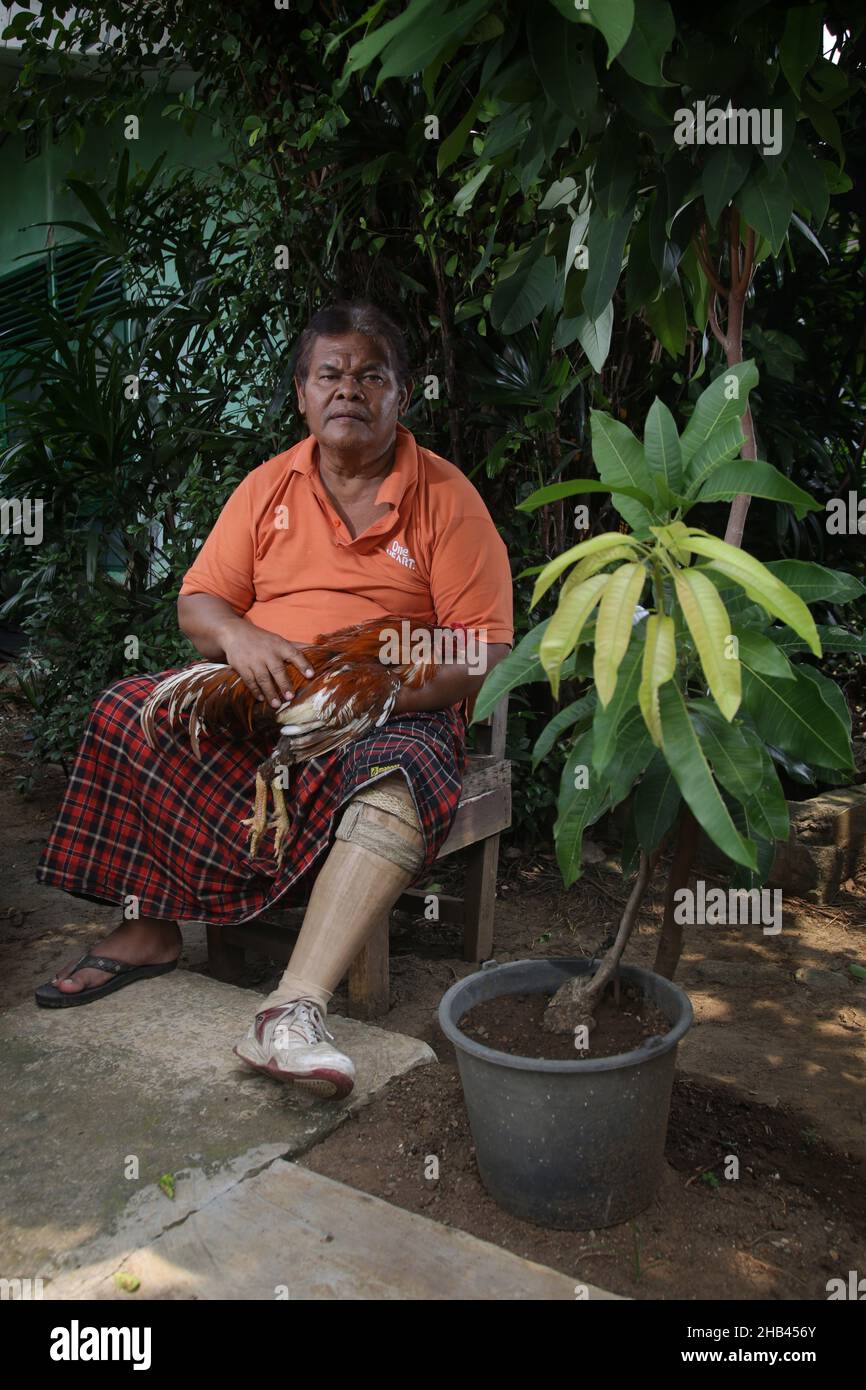 Bekasi, West Java, Indonesia. 16th Dec, 2021. Suparni, 65, a retired ...