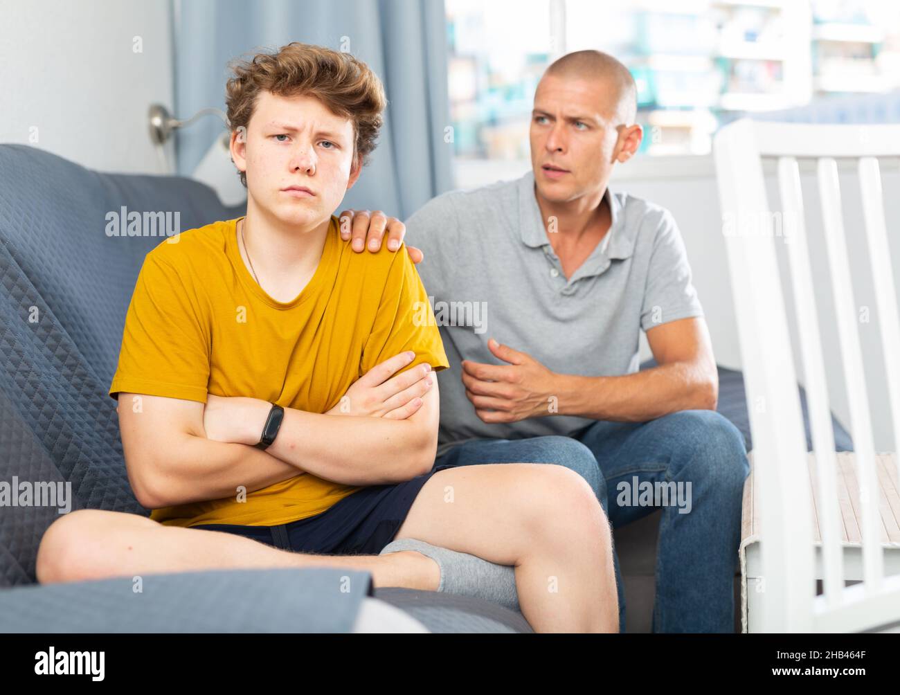 Father comforting his son Stock Photo - Alamy