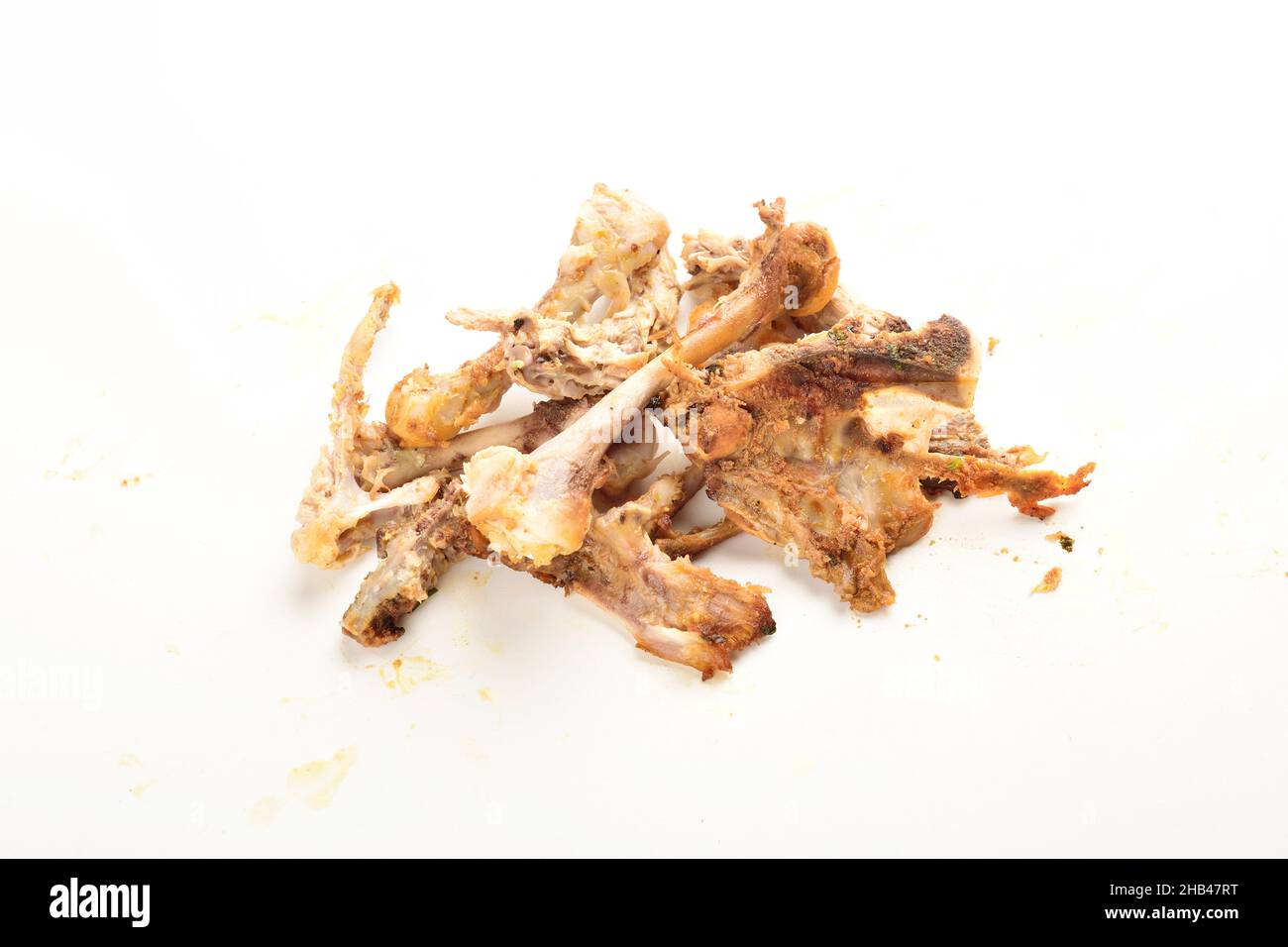 Leftover Chicken Bones on White Background Stock Photo - Alamy