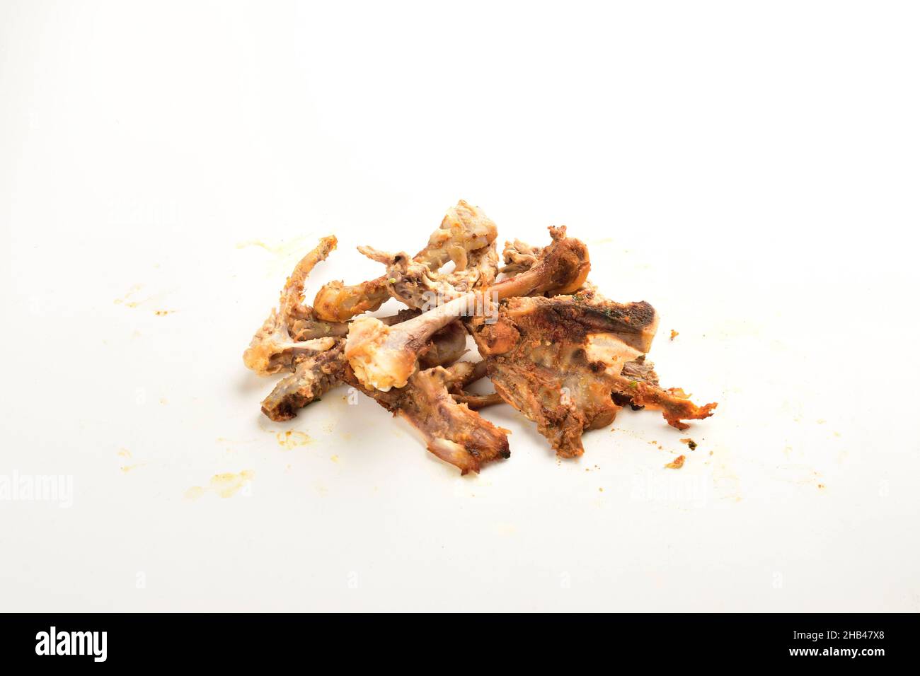 Leftover Chicken Bones on White Background Stock Photo - Alamy