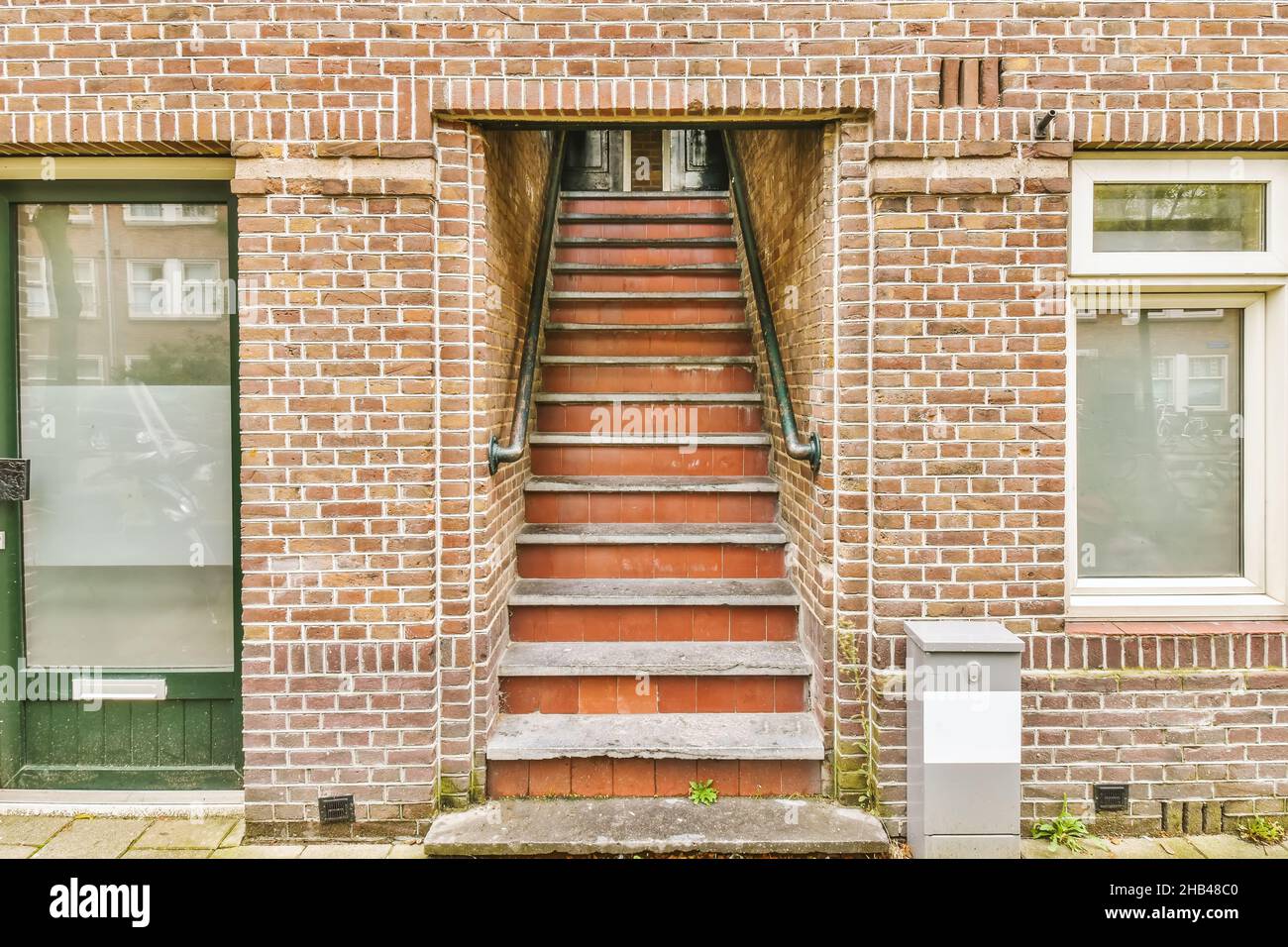 Staircase leading upstairs in a brick building Stock Photo - Alamy