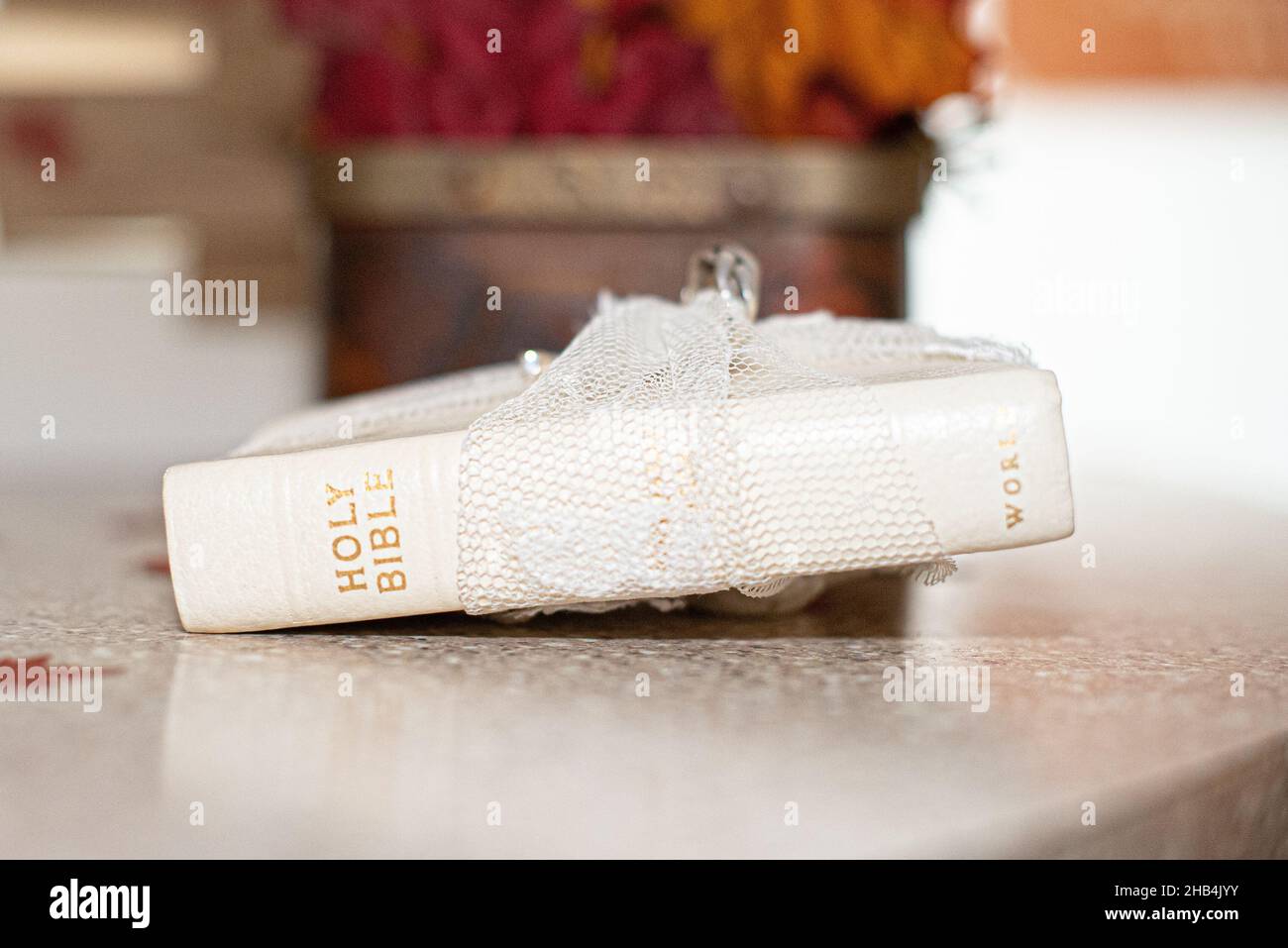 White white Holy Bible wrapped in lace on fall inspired table Stock ...