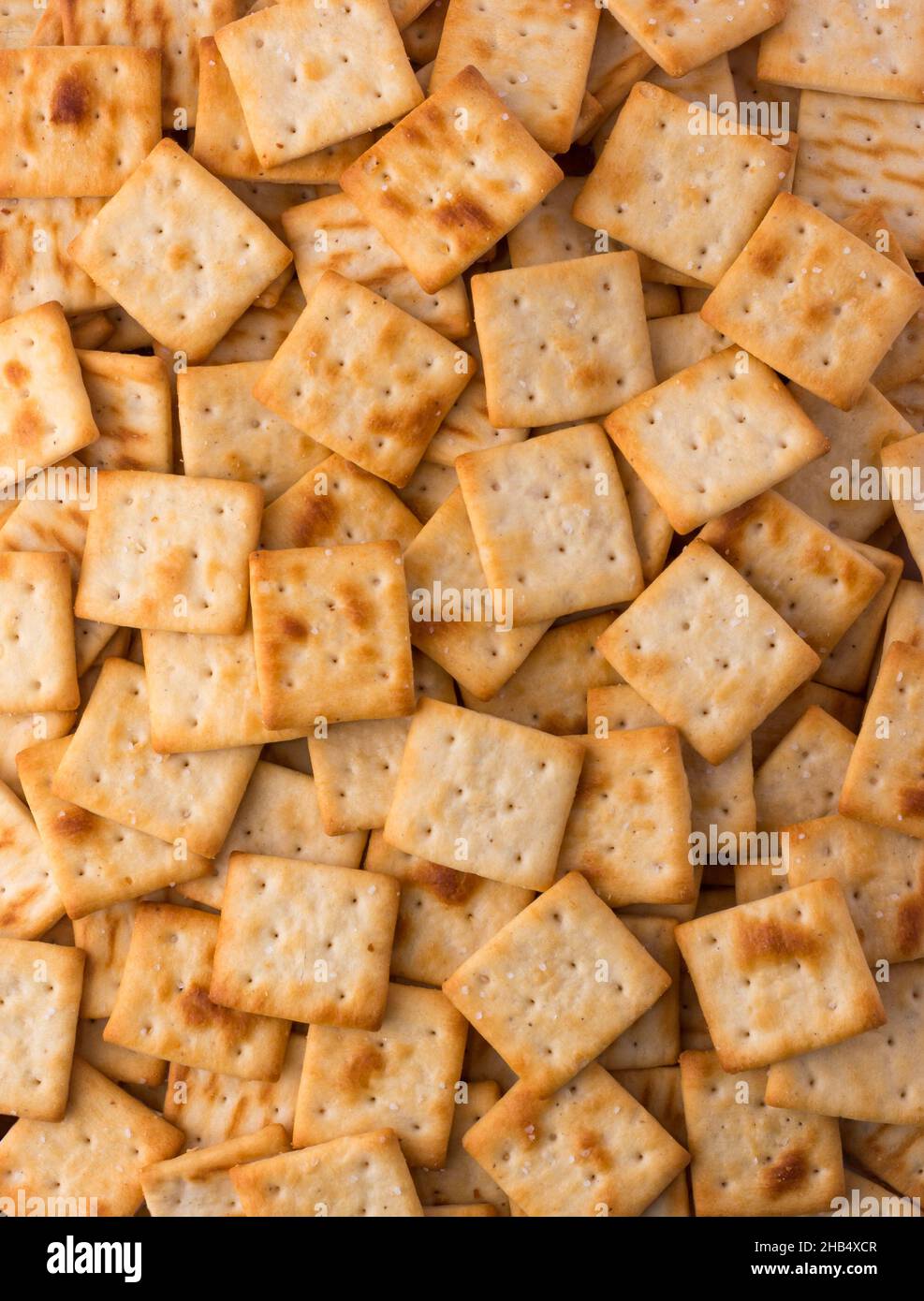 cheese biscuits background, crispy and crunchy square shape crackers ...