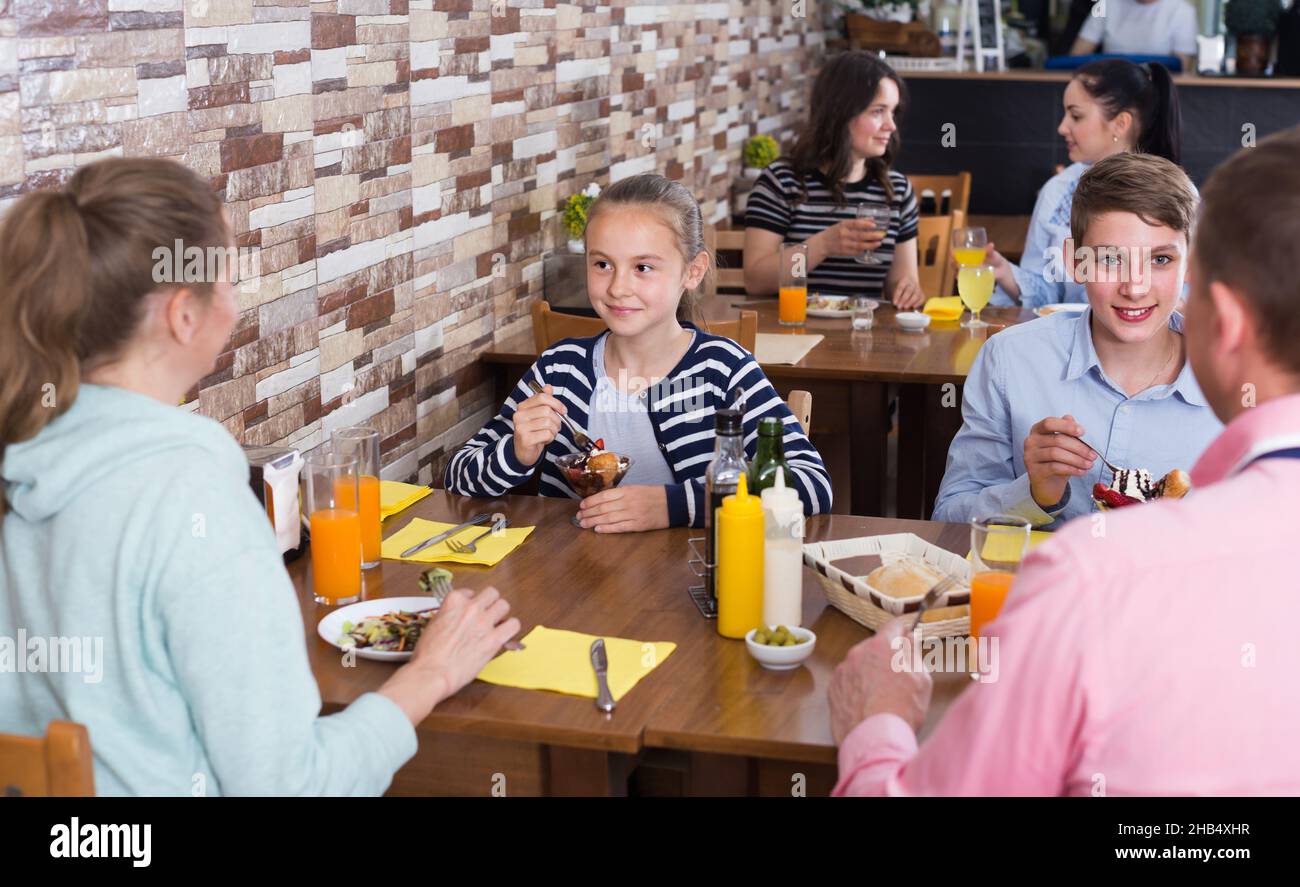 Positive family having lunch Stock Photo - Alamy