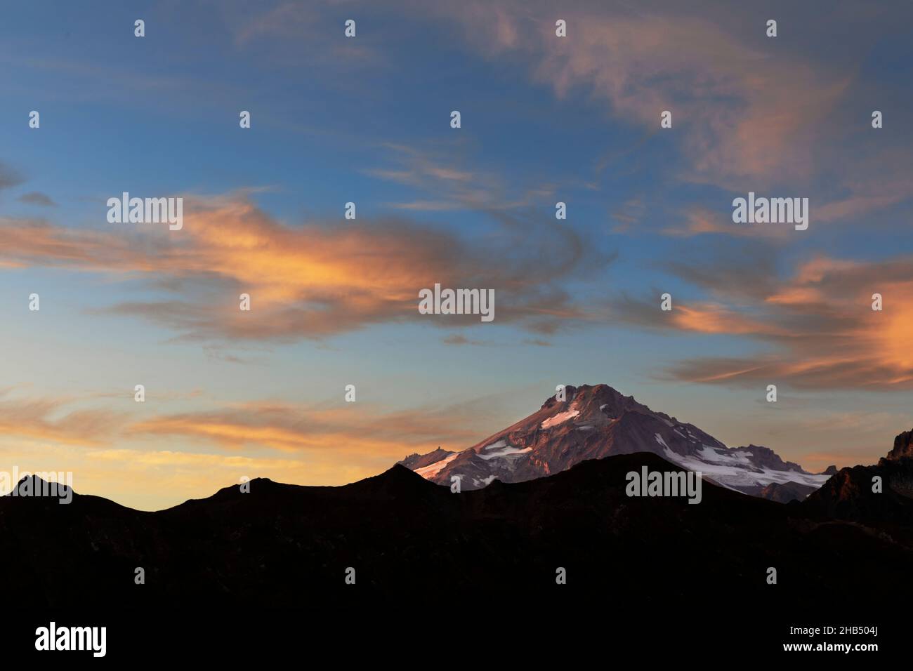 WA20513-00....WASHINGTON - Clouds over Glacier Peak along the Pacific ...