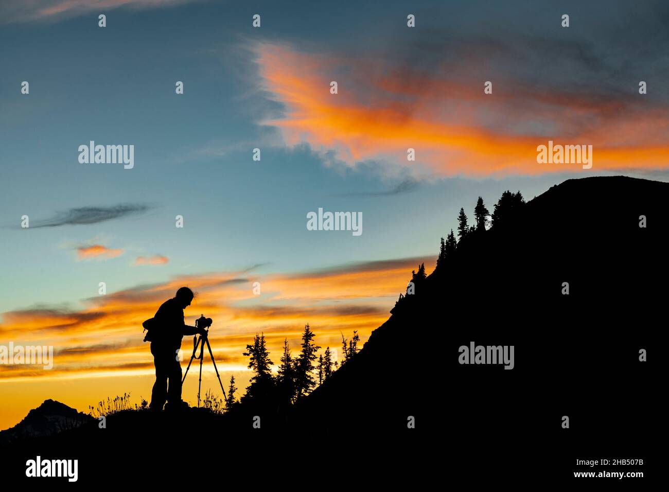 WA20516-00....WASHINGTON - Vicky Spring photographing sunset along the Pacific Crest Trail in ...