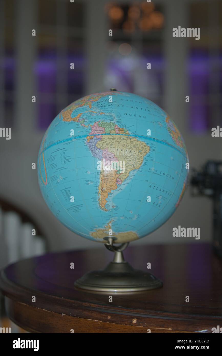 World map globe on wooden table Stock Photo - Alamy