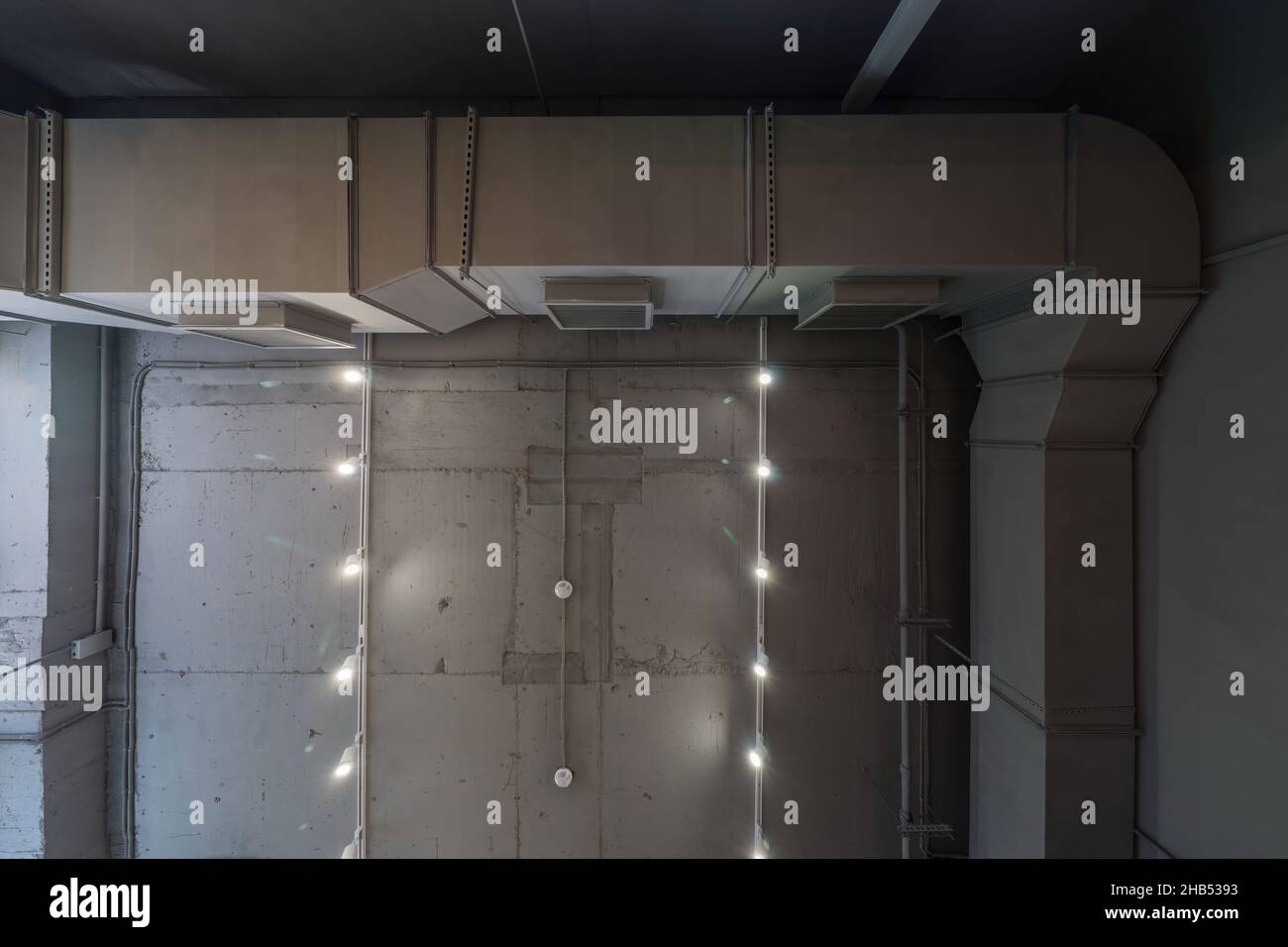 Abstract loft interior of concrete grey ceiling with air ventilation ...