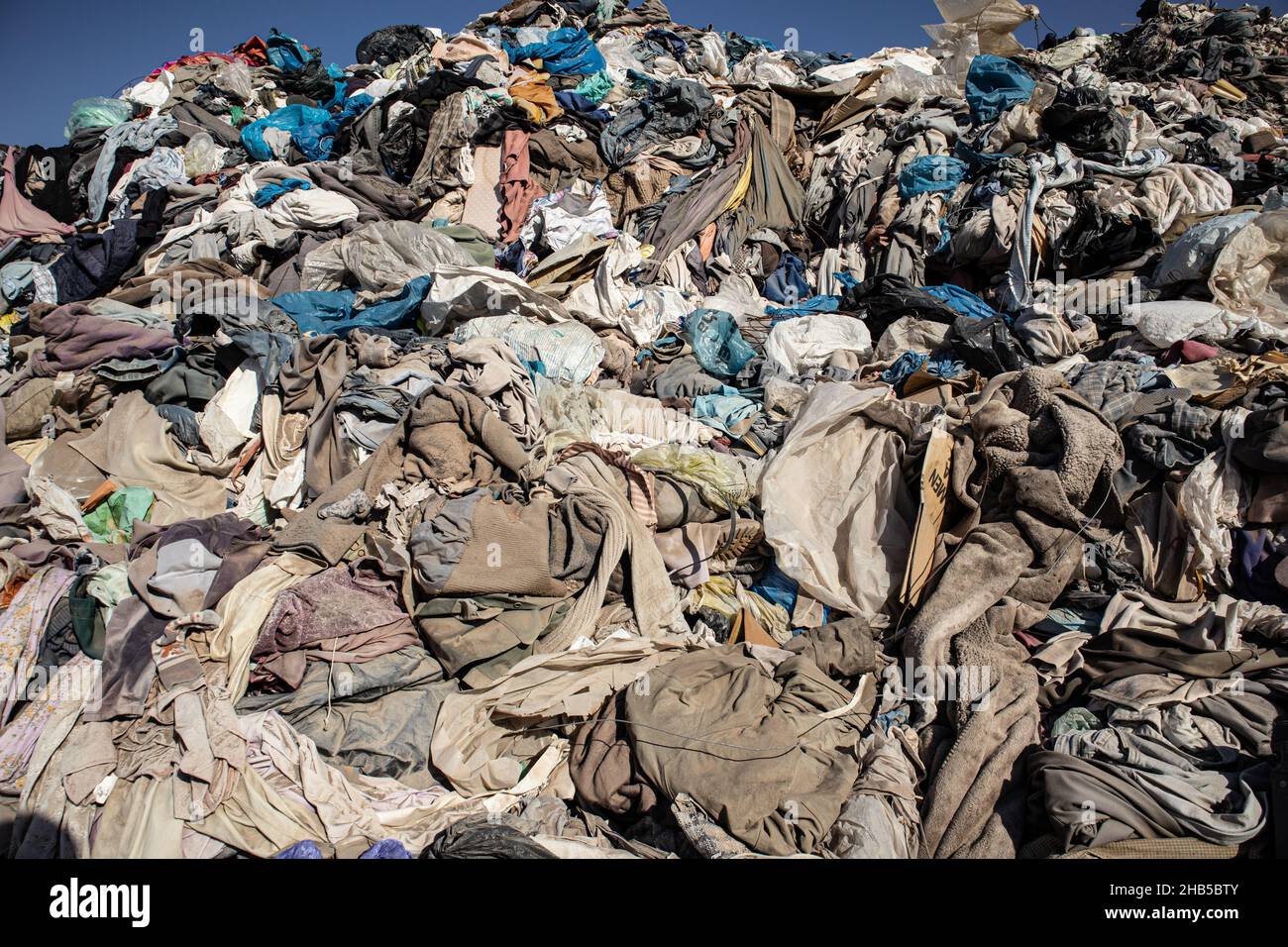 Alto Hospicio, Chile. 25th Nov, 2021. Used clothes sit in a landfill in ...