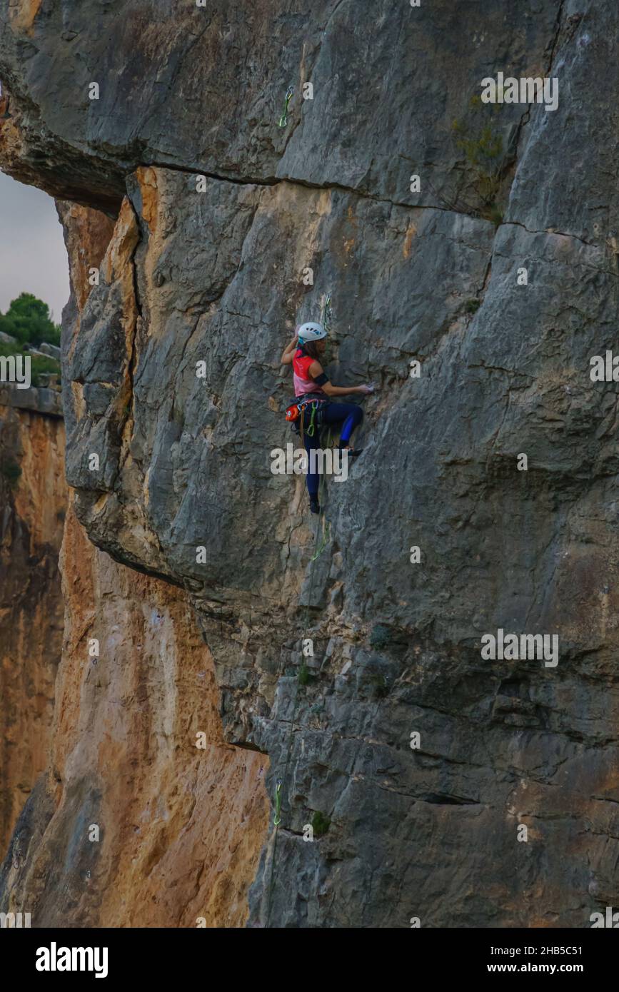 Young woman practices rock climbing in Chulilla. Valencia. December ...
