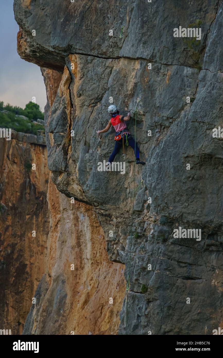 Young woman practices rock climbing in Chulilla. Valencia. December ...