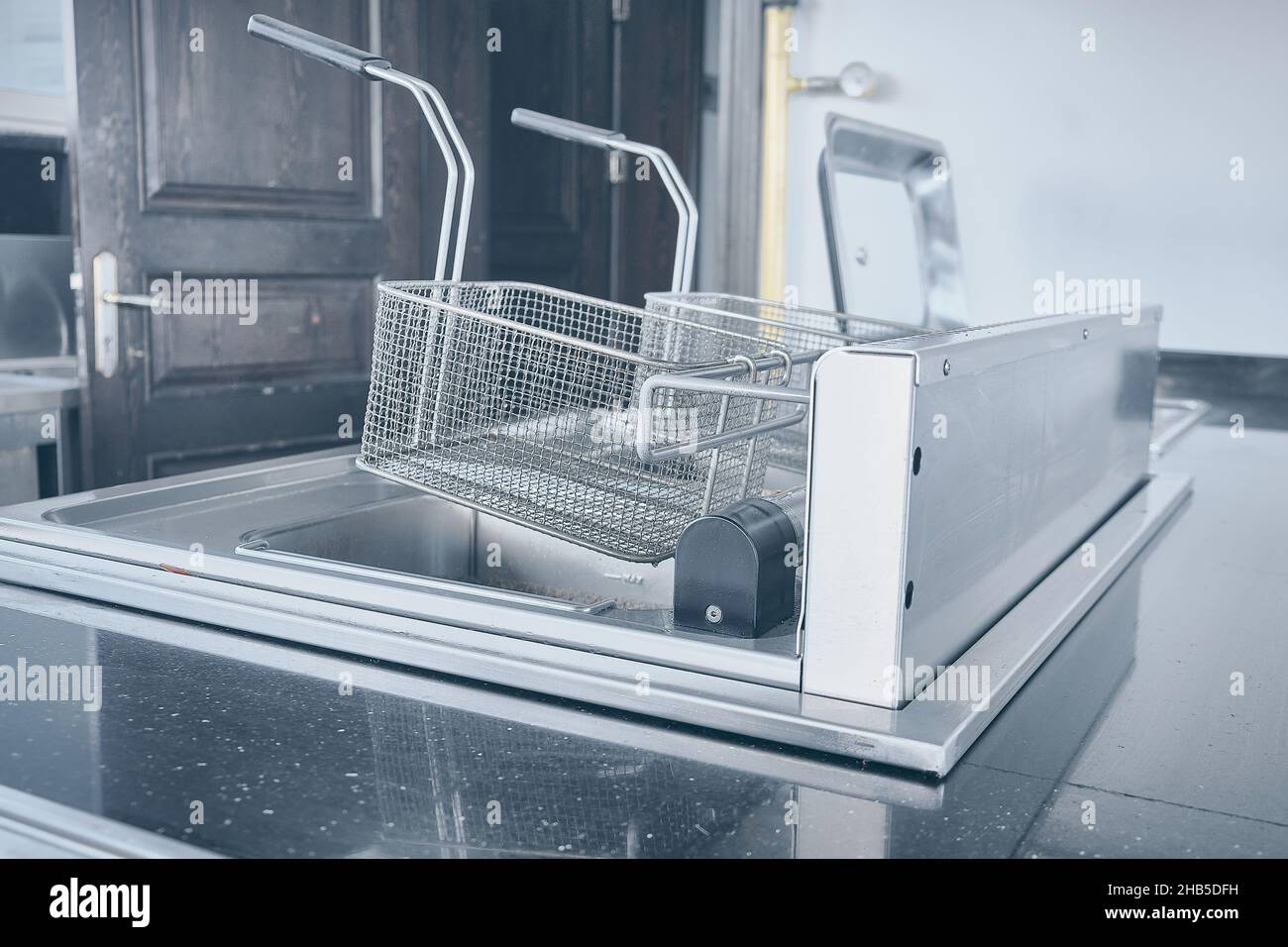 Empty stainless steel deep-fryer canteen containers Stock Photo - Alamy