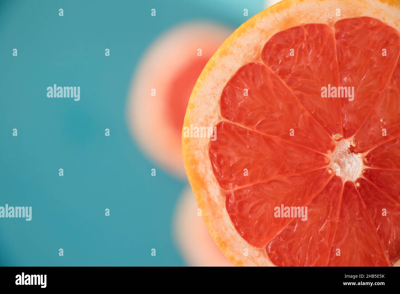 Sliced grapefruit on the blue background, cut grapefruit Stock Photo ...