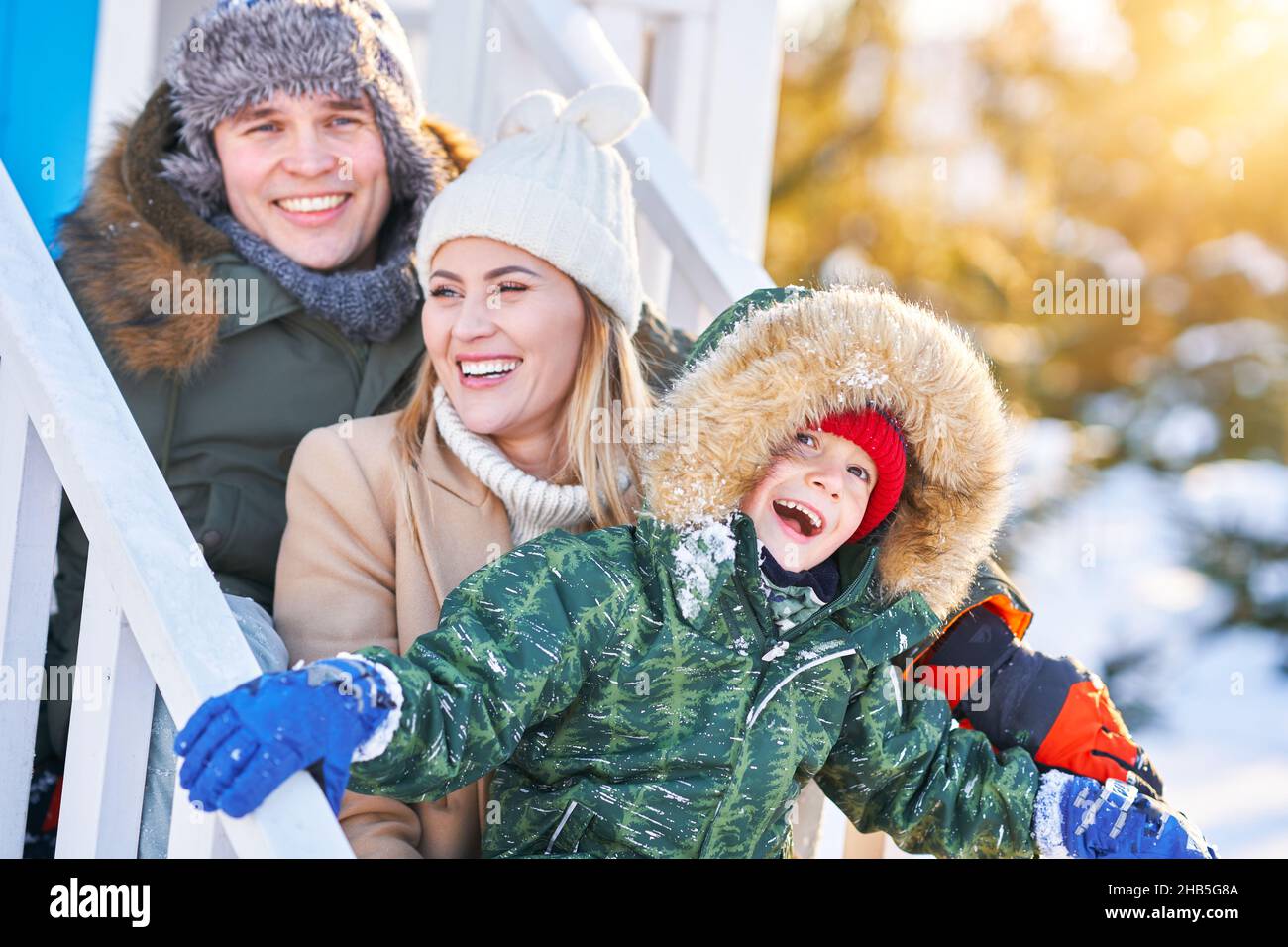 Nice happy family having fun on winter snow Stock Photo - Alamy