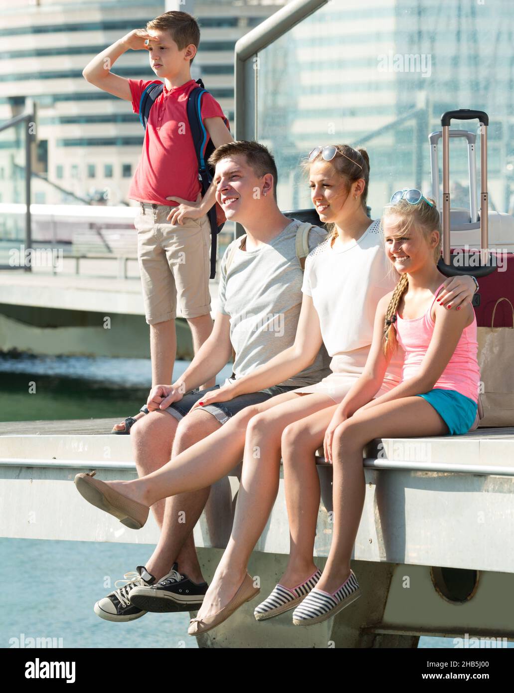Tourist family with children are relaxing Stock Photo - Alamy