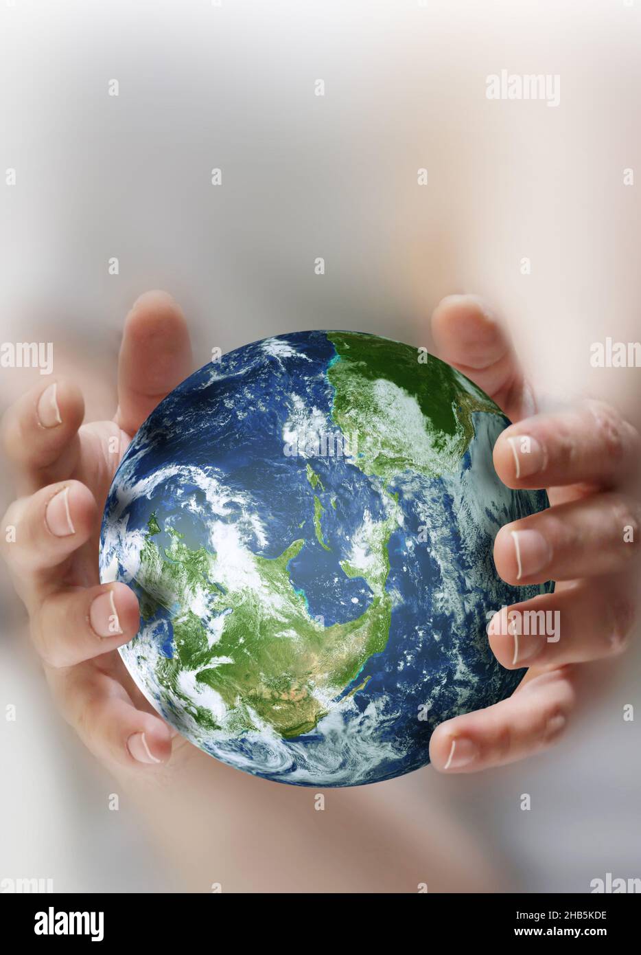 hands holding a globe, saving environment recycle Stock Photo - Alamy