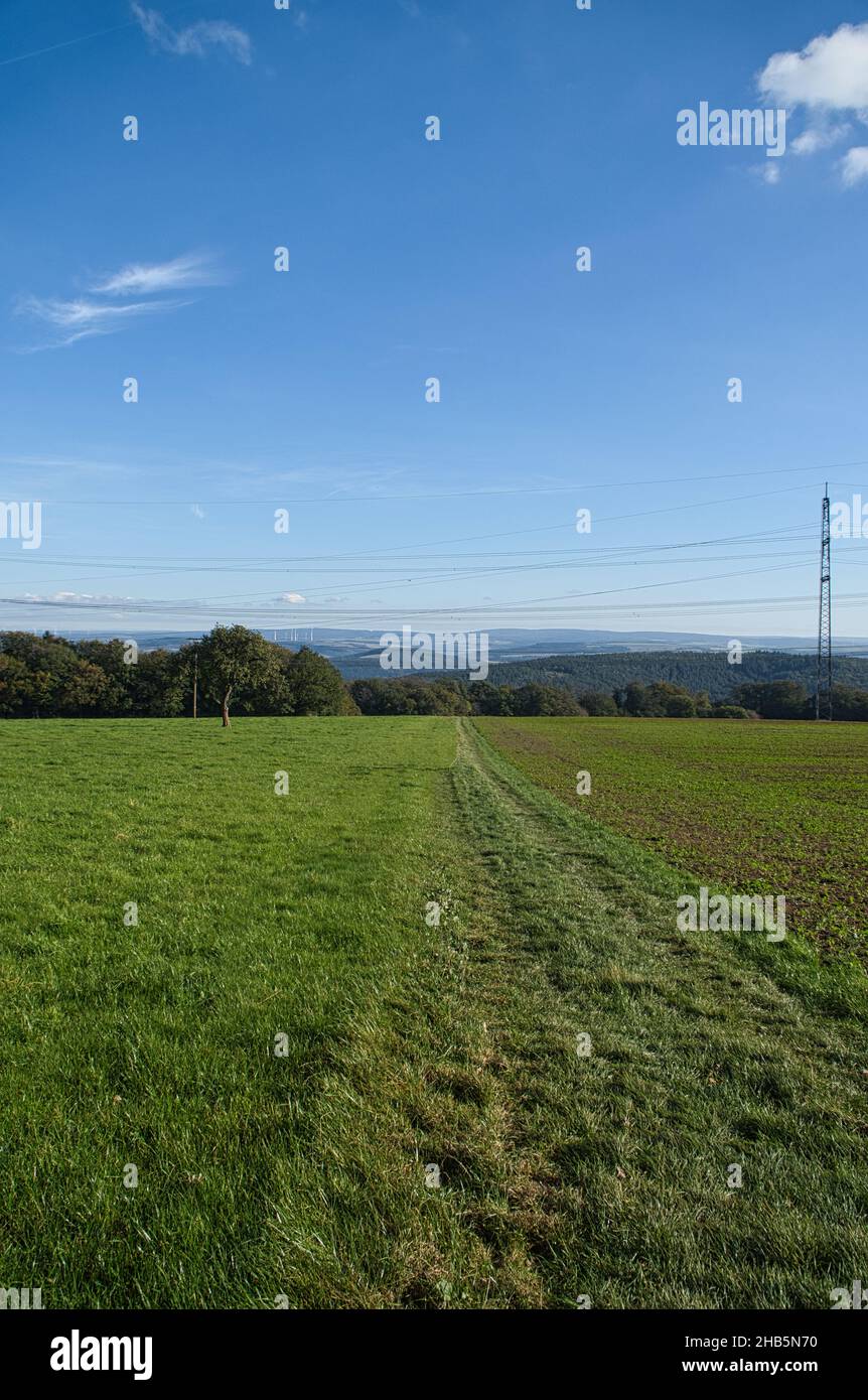 landscape with hills, fields, meadows, and agriculture. Hiking in ...