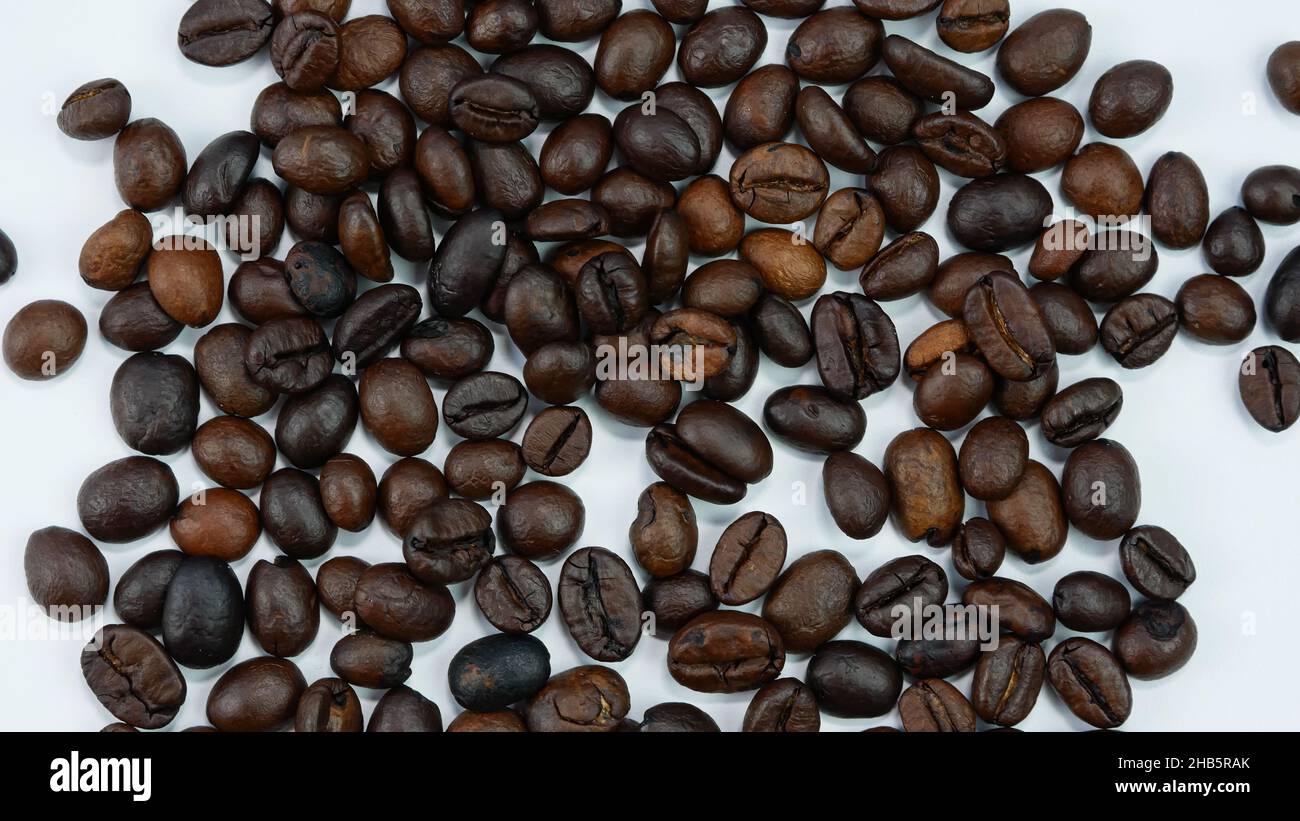 roasted coffee beans isolated on a white background Stock Photo - Alamy