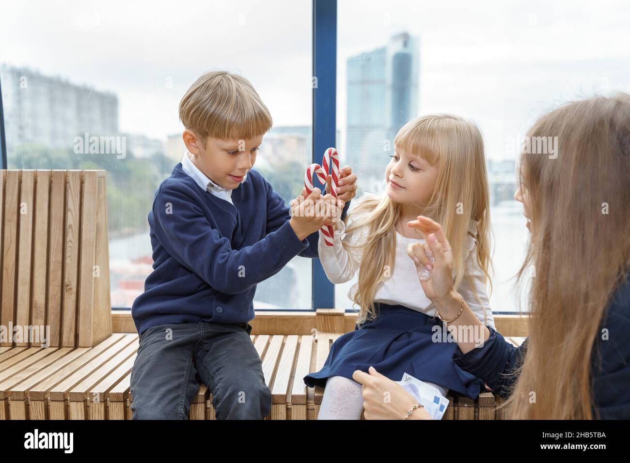 Child gives candy hi-res stock photography and images - Alamy