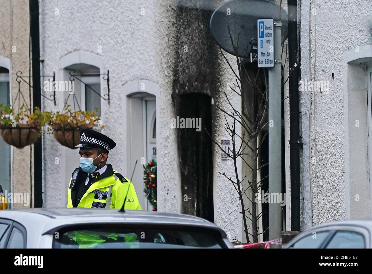 Police at the scene in Sutton, south London, where four children who ...