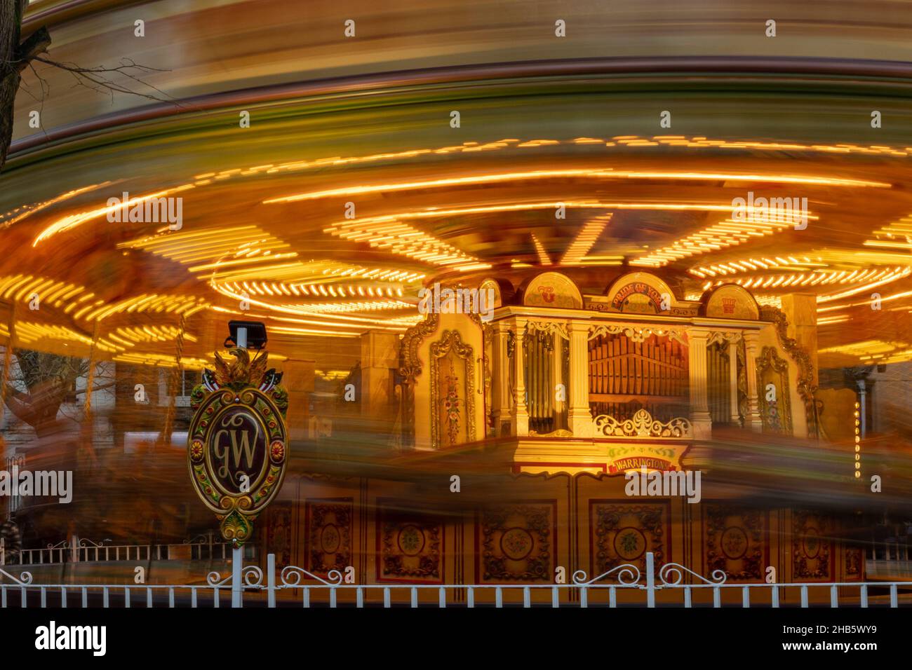 Carousel at Night with Blurred Lights Stock Photo - Alamy