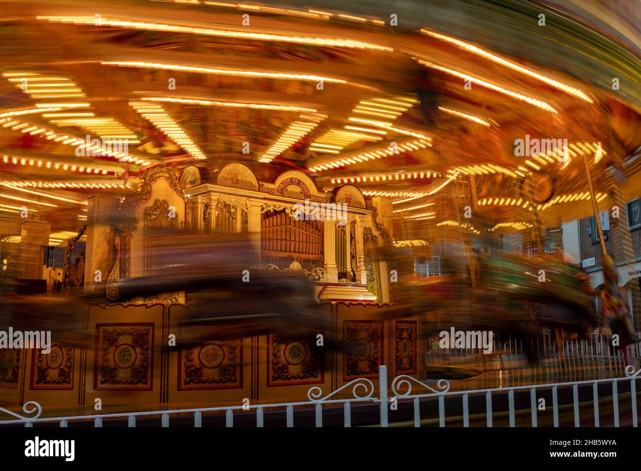 Carousel at Night with Blurred Lights Stock Photo - Alamy