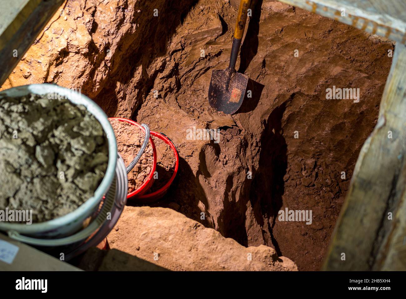 Digging the basement under the house manually, unloading soil with ...