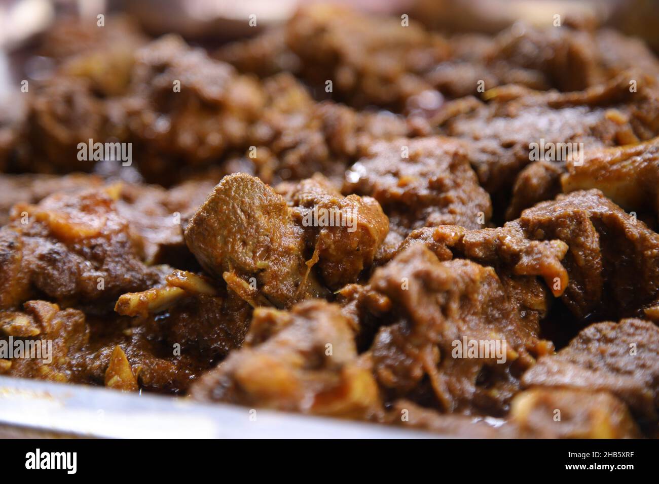 Closeup shot of mutton cooked in thick gravy.Traditional Indian style ...