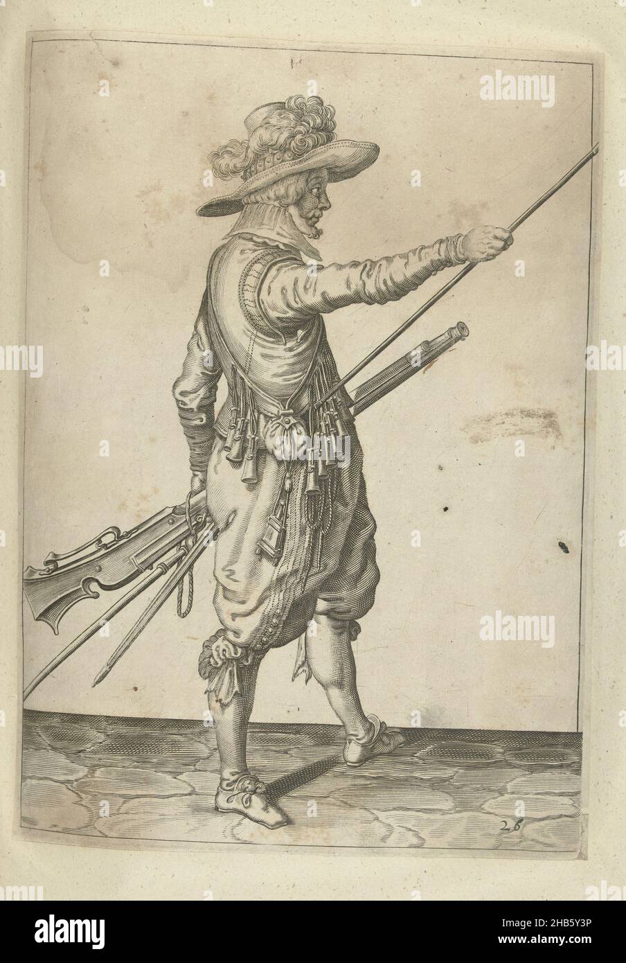 Soldier with a musket sliding his right hand to the end of his ramrod ...