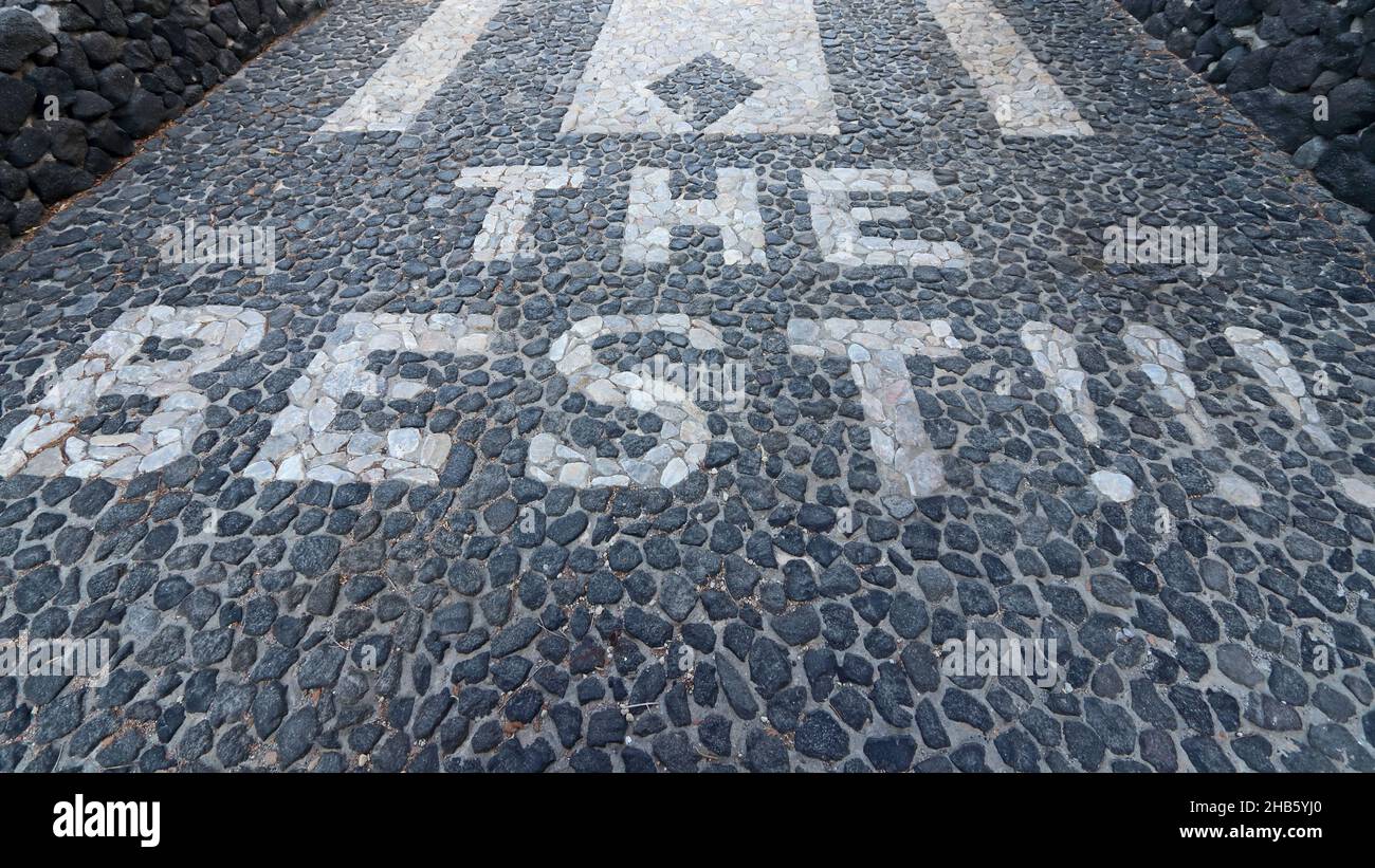 The Best!!! marked in white stones set into cobbled path, Perissa ...