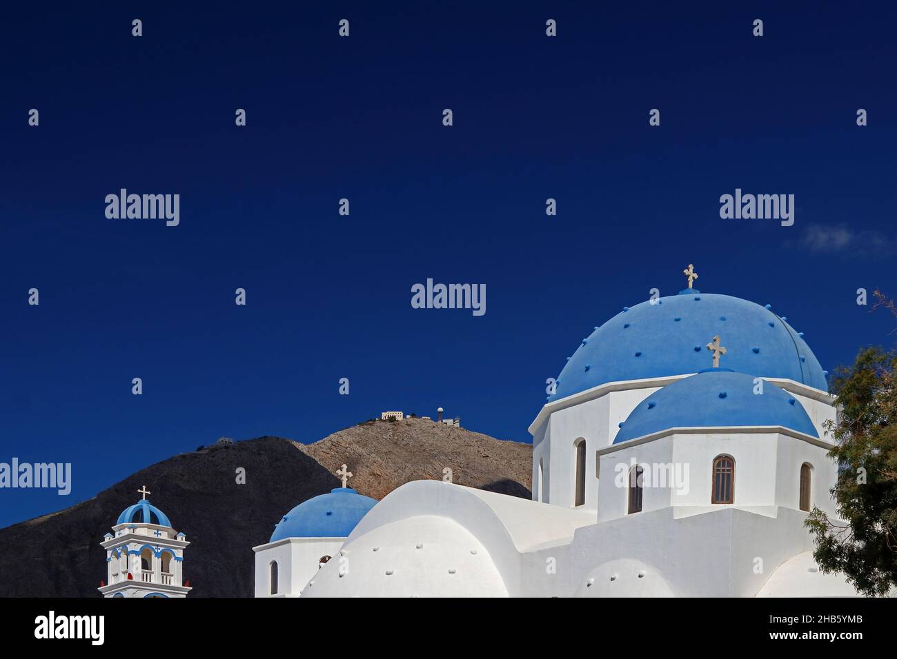 Blue domed Greek Orthodox Church of Holy Cross, Perissa, Santorini ...