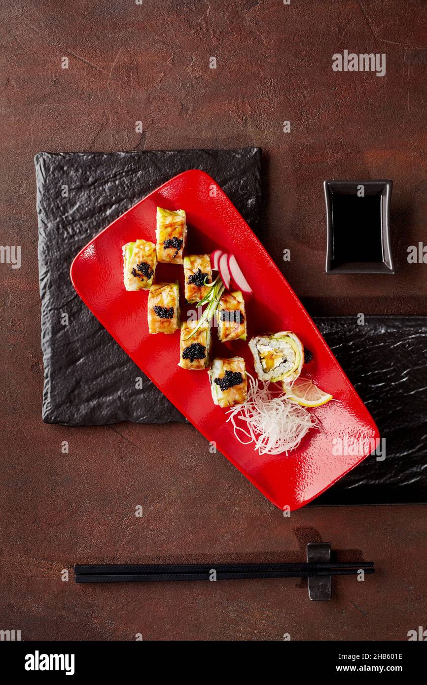 Uramaki rolls with avocado, shrimp, black tobiko, cream cheese, mango ...