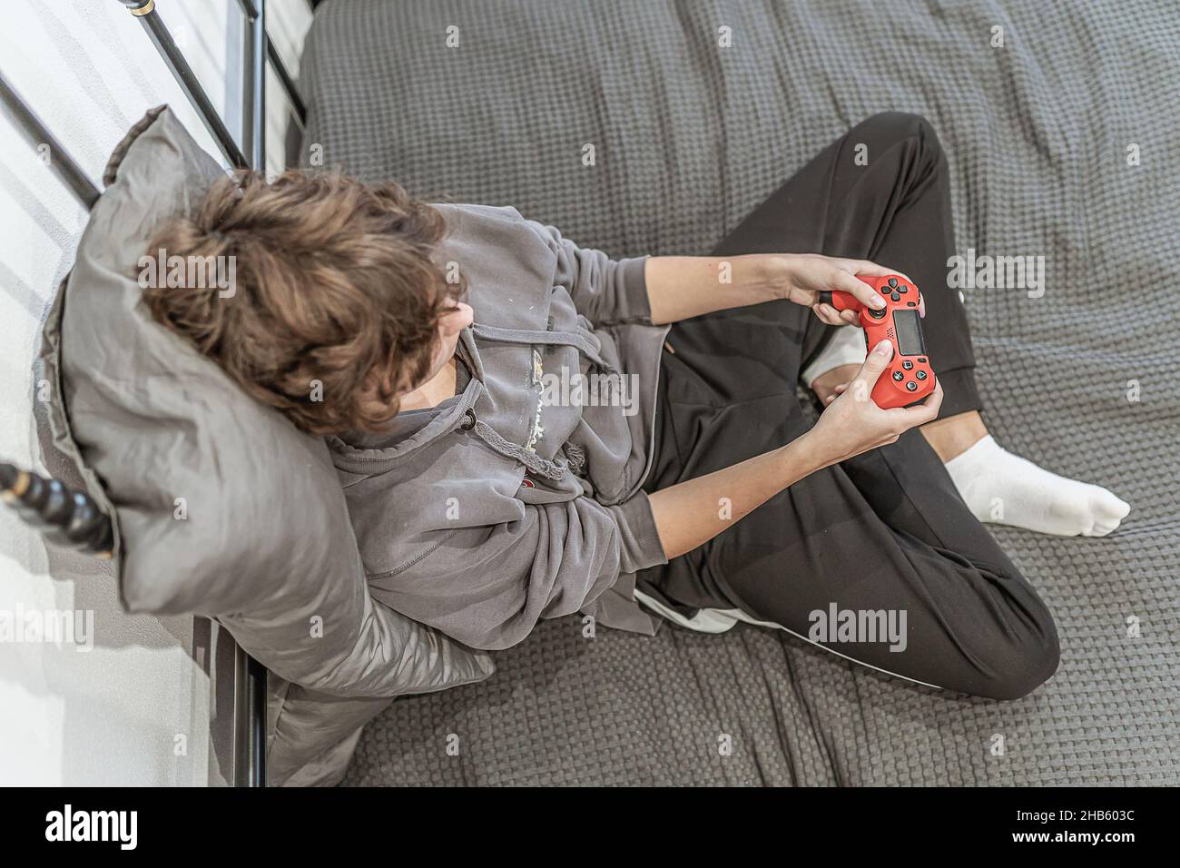 teenage girl with short brown curly hair, dressed in unkempt home ...