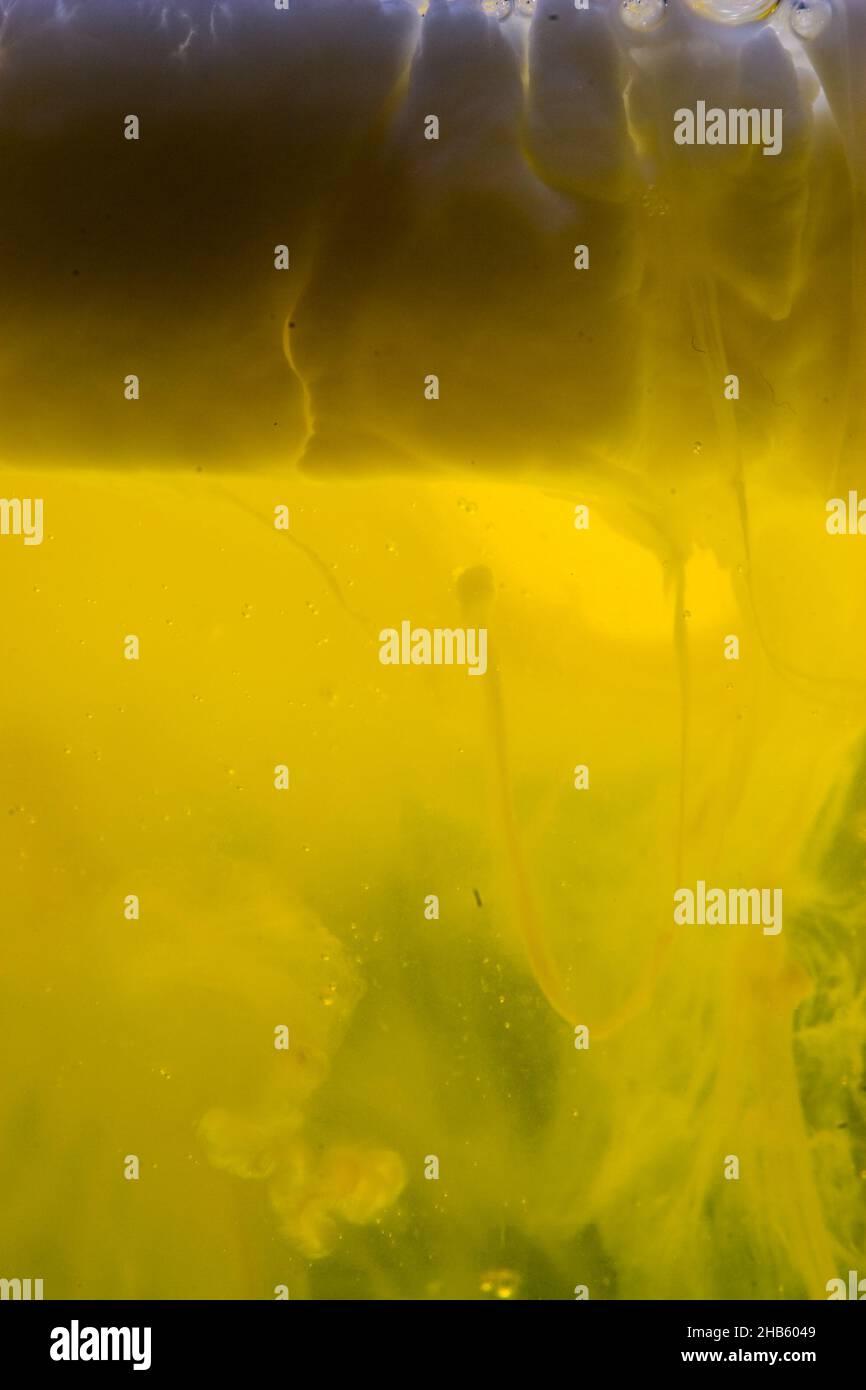 Vertical shot of yellow liquid background Stock Photo - Alamy