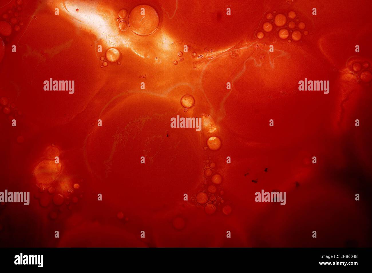 Red liquid with bubbles Stock Photo - Alamy