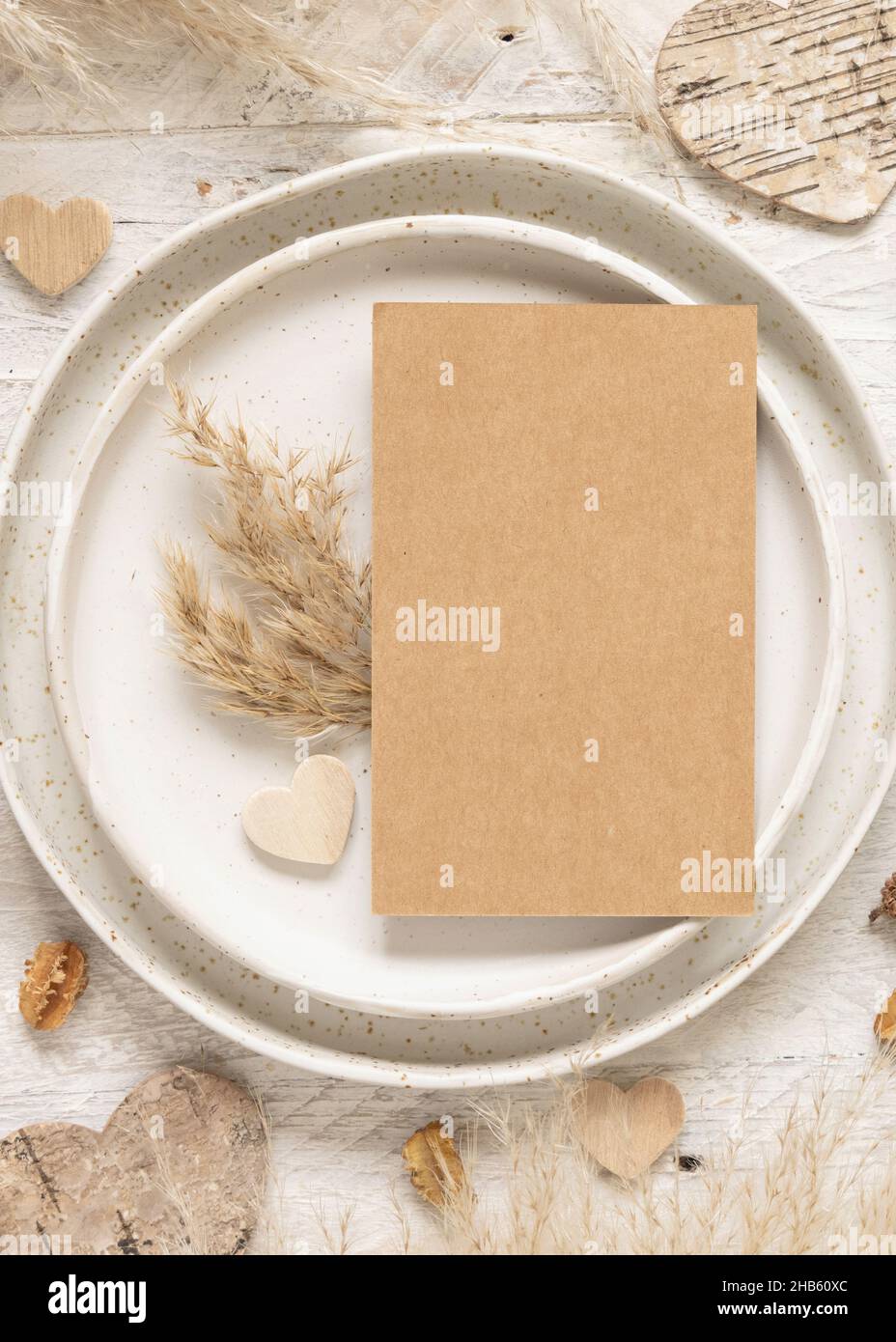 Wedding table place with blank card near dried plants, palm leaves ...