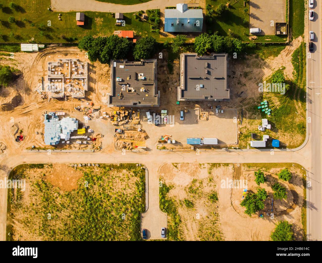 Top down view three buildings roof tops in construction site in ...