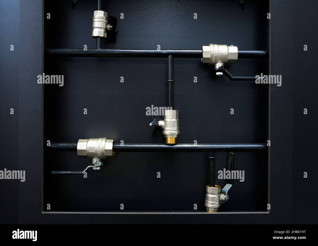 Ball valves placed on a stand. Plumbing equipment Stock Photo - Alamy
