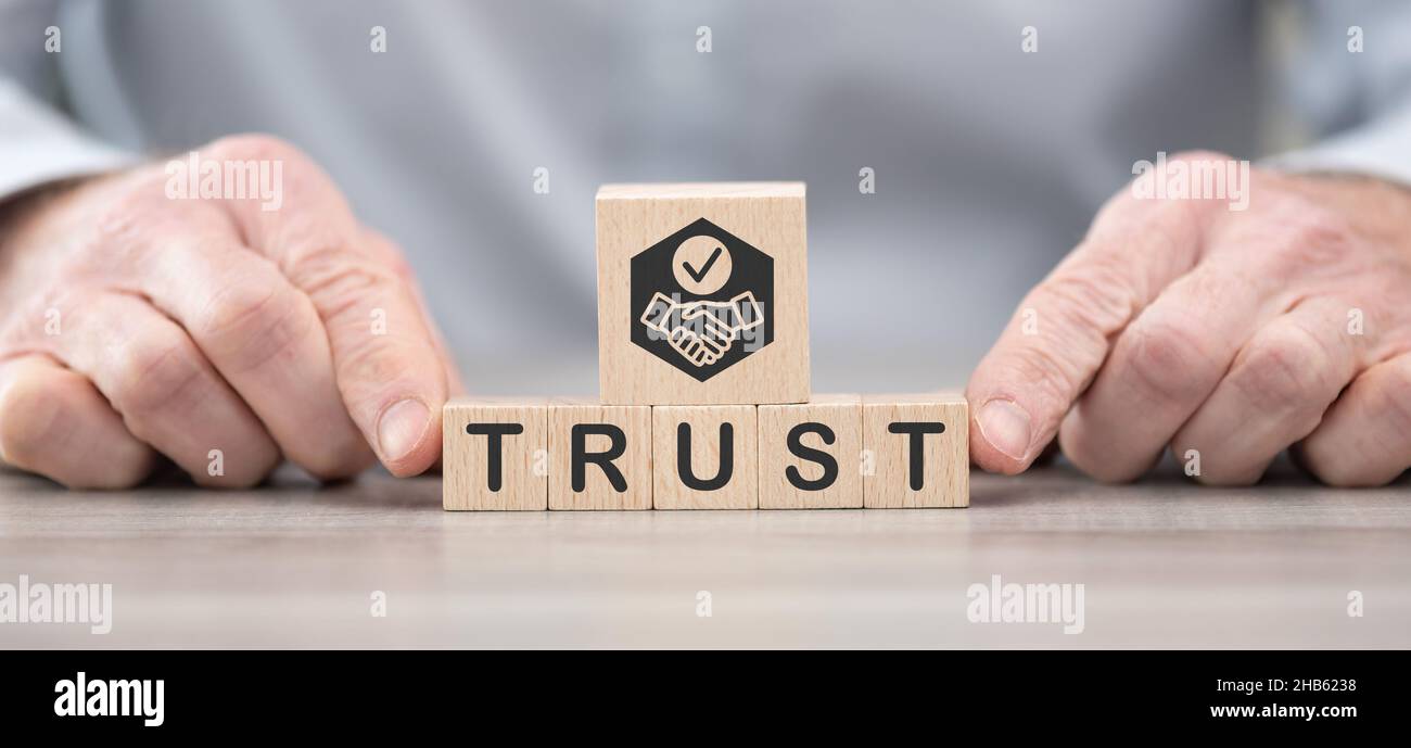 Wooden blocks with symbol of trust concept Stock Photo - Alamy
