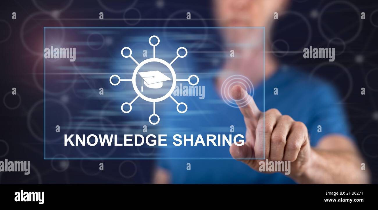 Man touching a knowledge sharing concept on a touch screen with his ...