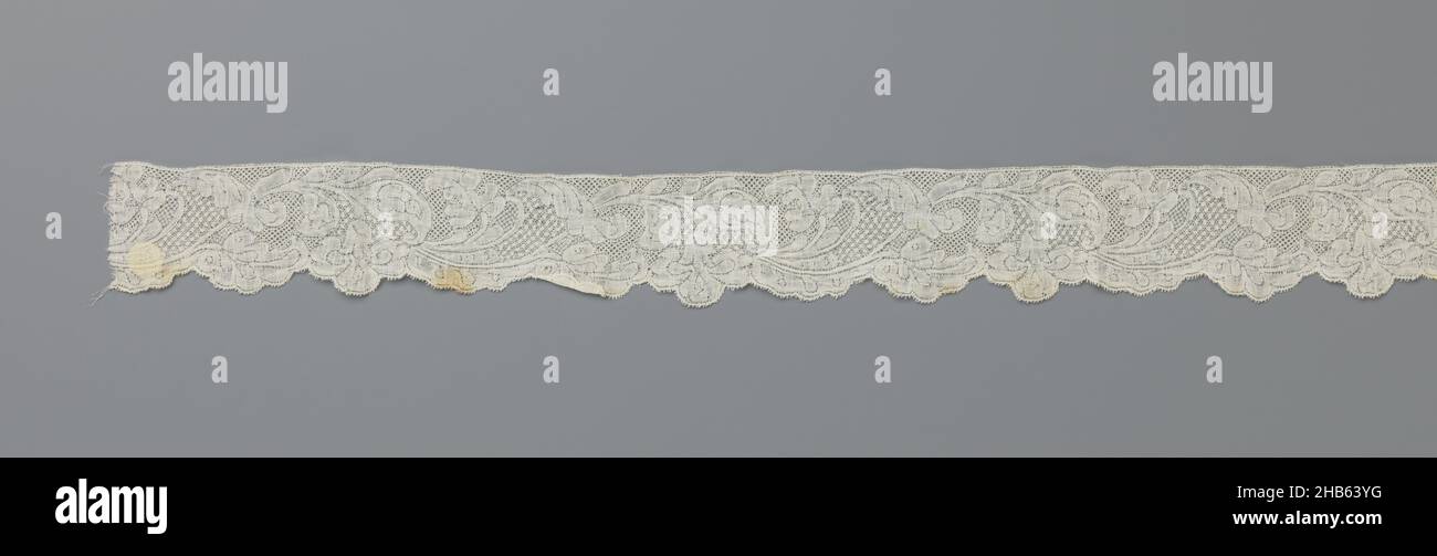 Strip of bobbin lace with horn of plenty closed by an acanthus leaf ...