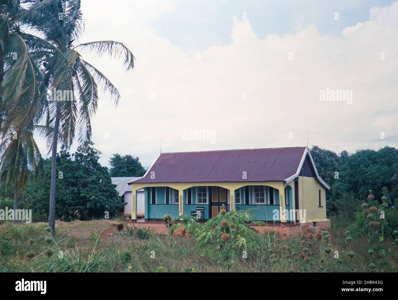 Traditional rural house in countryside with rusty corrugated iron roof ...