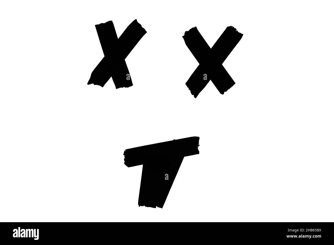 Eyes and mouth are painted with black paint on a white background ...