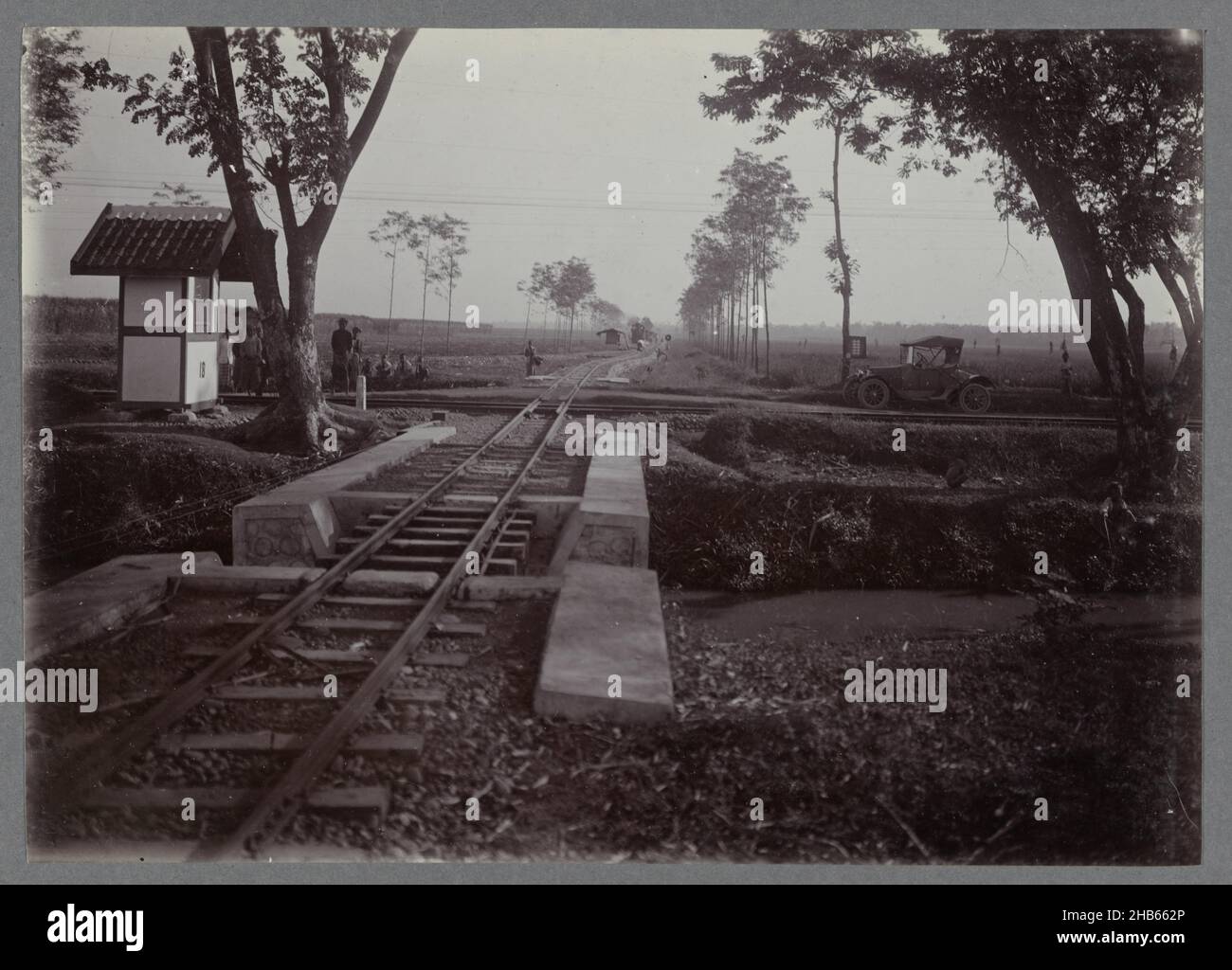Railroad crossing, A car and a guardhouse at a railroad crossing. Part ...