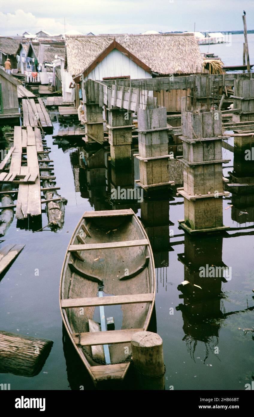Informal housing wooden shacks built on timber logs known as the ...
