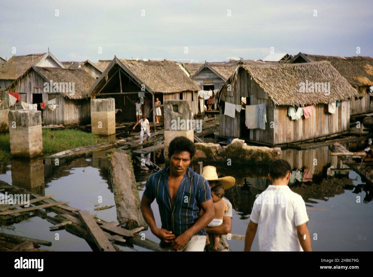 Informal housing wooden shacks built on timber logs known as the ...